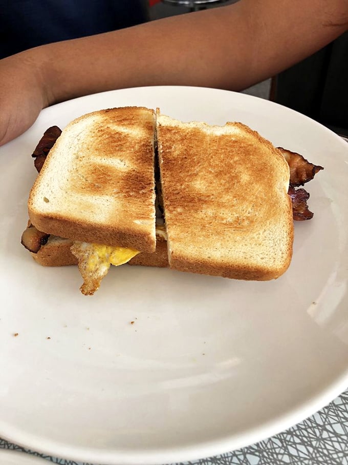 The breakfast sandwich—where bread meets egg meets cheese meets happiness. Simple math that always equals satisfaction.