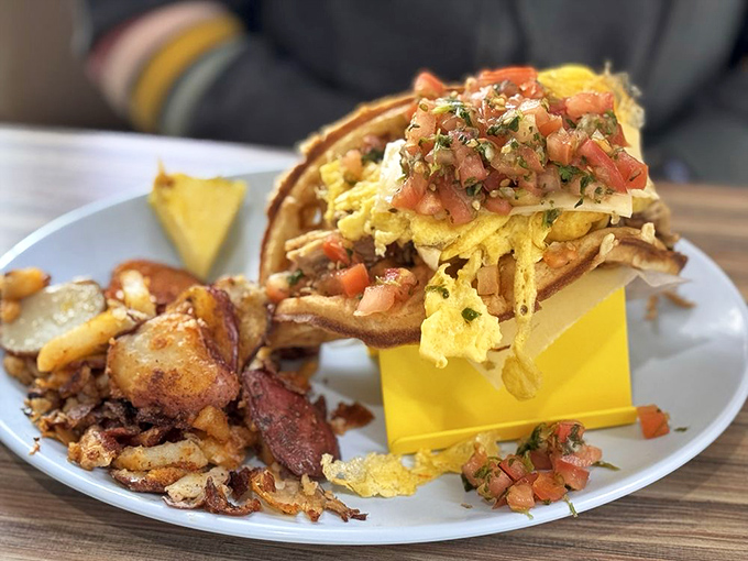 This breakfast taco isn't just a meal – it's edible architecture, with layers of eggs, fresh pico, and cheese creating a morning masterpiece.