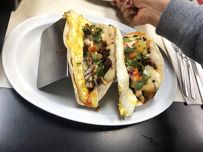 Breakfast tacos that bridge cultures – scrambled eggs and savory fillings nestled in warm tortillas create handheld happiness worth waking up for.