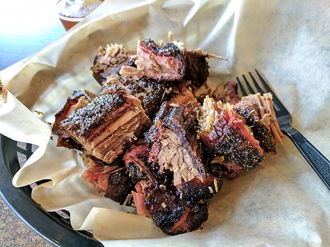 Brisket with that telltale smoke ring isn't just meat—it's a time capsule of patience, capturing hours of slow-smoking in each succulent bite.