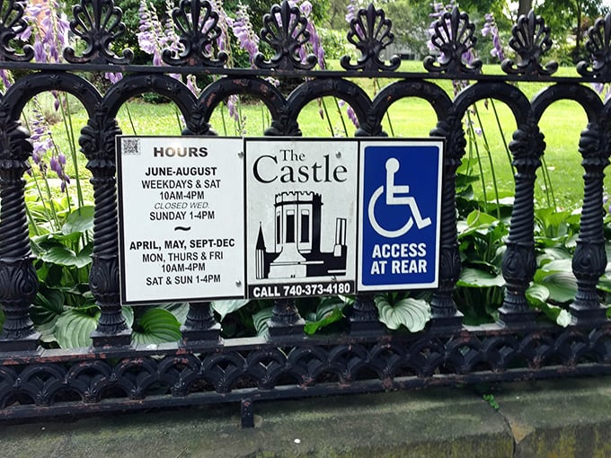 Even castles have business hours. This ornate iron fence serves as both boundary and invitation to the curious traveler.