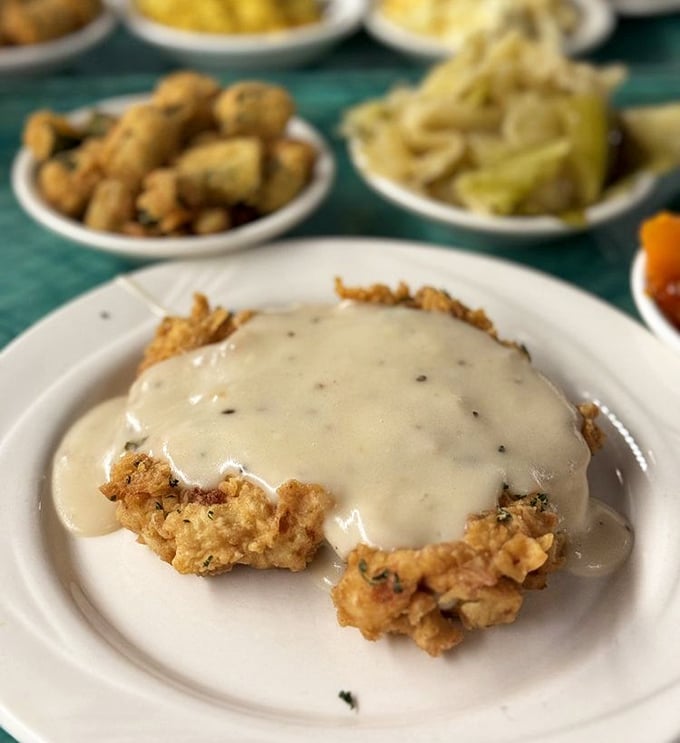 Chicken fried steak bathed in creamy gravy that doesn't just speak Southern—it sings it with a full gospel choir backup.