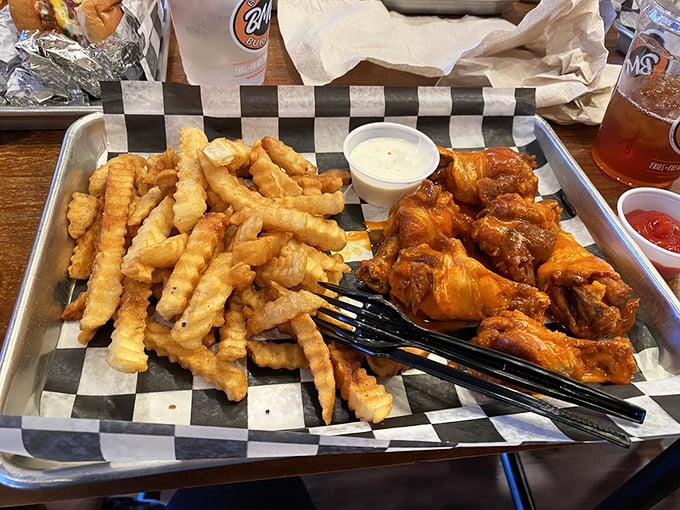 Crispy fries and saucy wings—the dynamic duo of comfort food. No superhero cape required, just extra napkins.