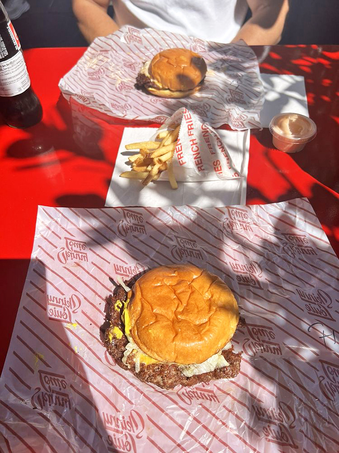 Behold the classic burger in its natural habitat—crispy edges, melty cheese, and a bun that knows its role in this delicious drama.