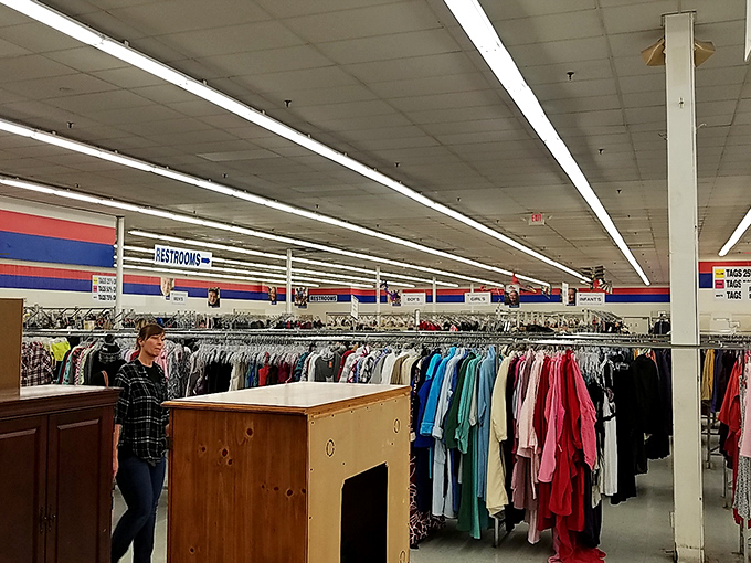 The clothing section stretches like a textile ocean. Somewhere in this sea of fabric swims the perfect vintage concert tee.