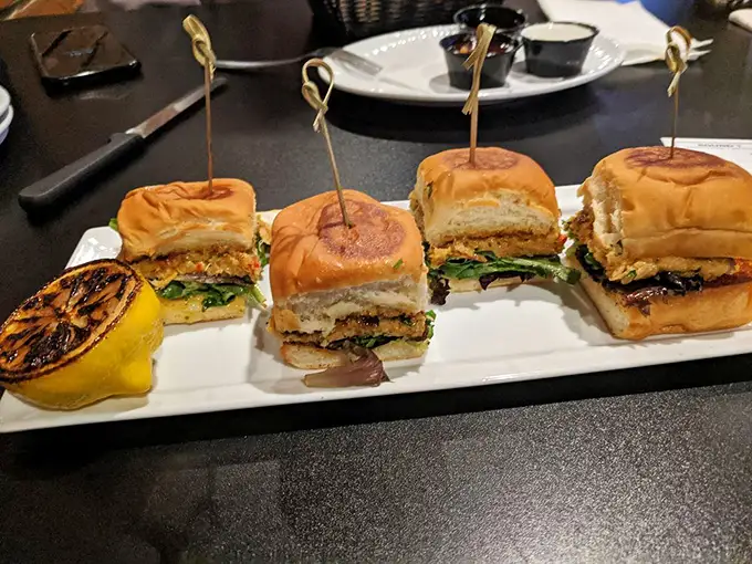 Slider perfection: four little sandwiches lined up like culinary soldiers, ready to march straight into your heart (and stomach).