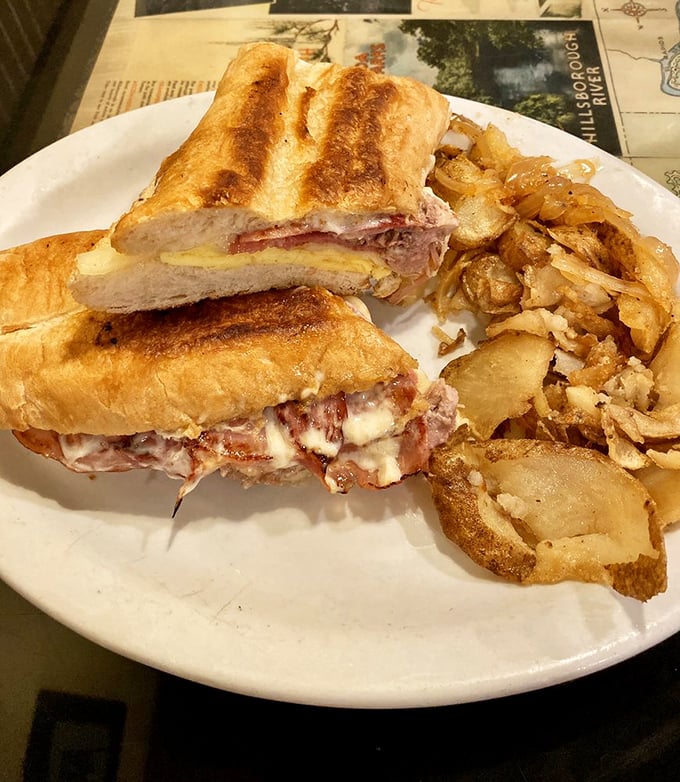 This Cuban sandwich isn't just lunch – it's a Florida tradition pressed between bread, with melty cheese escaping from the sides like delicious lava.