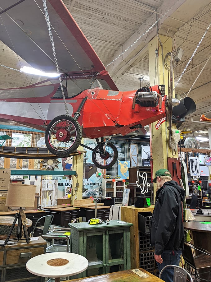 One shopper contemplates whether that red biplane overhead comes with the coffee table – stranger things have happened here.