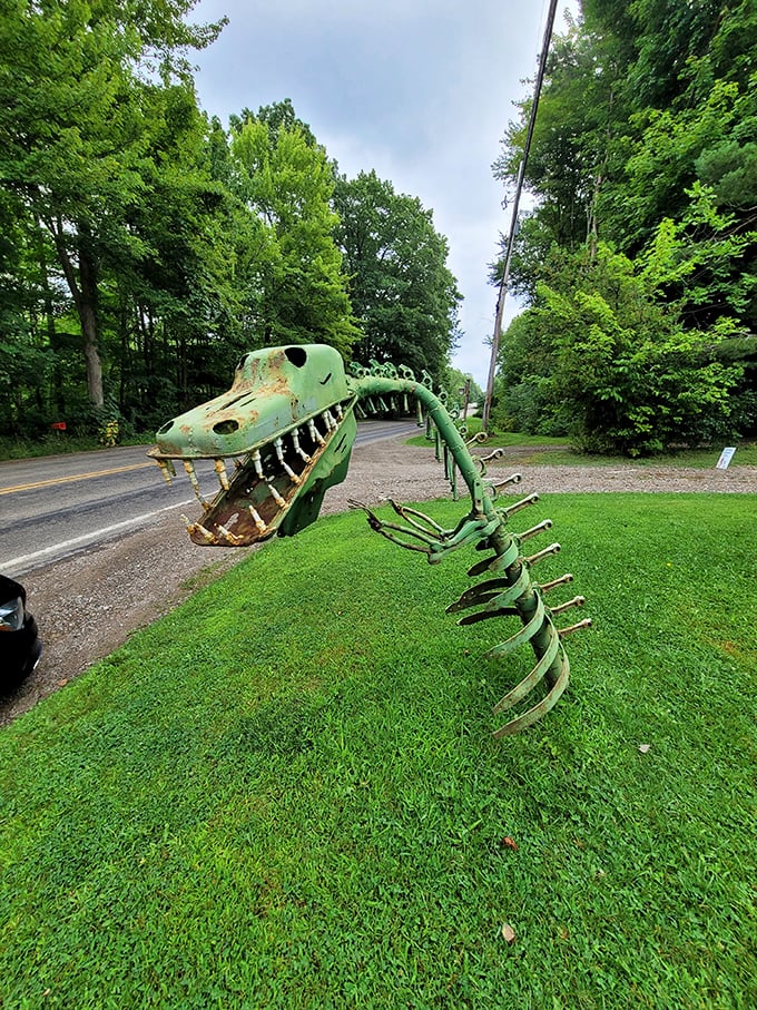 This prehistoric predator proves dinosaurs didn't completely disappear—they just transformed into spectacular scrap metal masterpieces along Route 5.