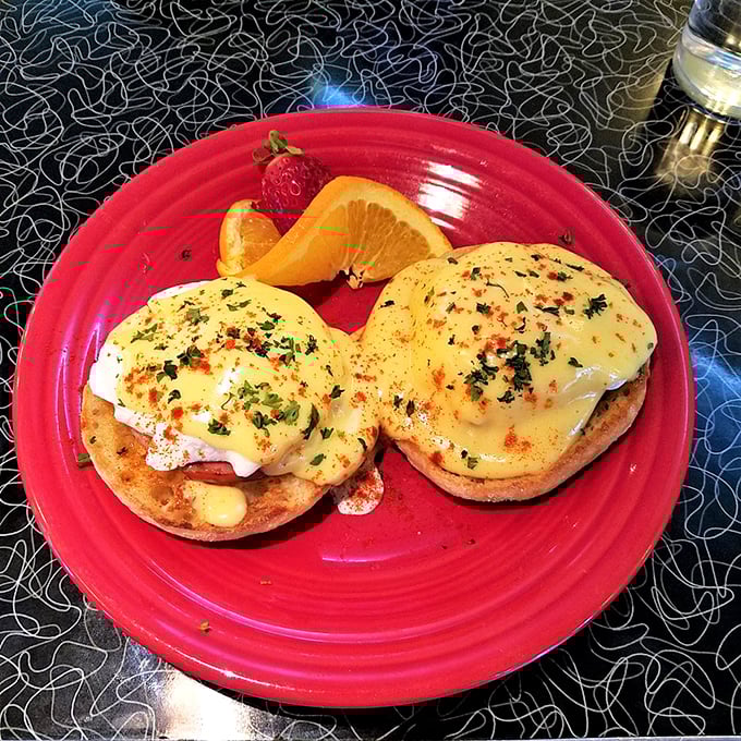 These eggs Benedict aren't just breakfast—they're tiny thrones of English muffin royalty, crowned with perfectly poached eggs and hollandaise regalia.