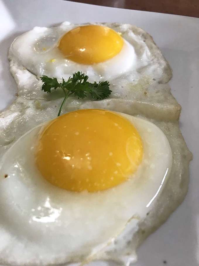 Sunny-side perfection! These eggs stare back with golden eyes, daring you not to fall in love at first bite.