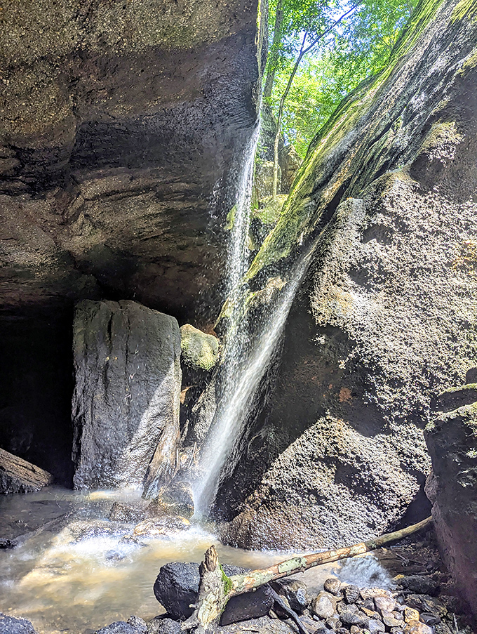 Nature's shower system! After a good rain, these falls transform from a whisper to a conversation, cascading down rocks that have been perfecting their pose for millions of years.
