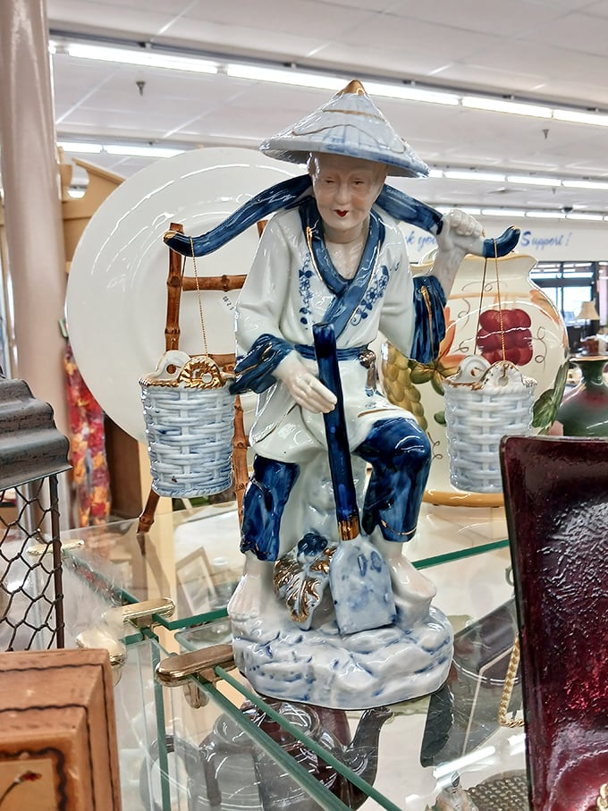 This porcelain fisherman figurine is the conversation piece your mantel never knew it needed. Blue-and-white chinoiserie meets Delaware thrift culture.