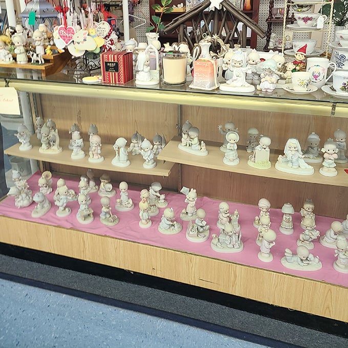 Precious Moments figurines line up like tiny porcelain soldiers ready to march into collectors' hearts.