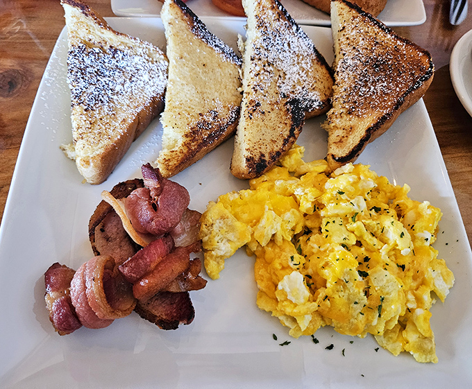 French toast, bacon, and eggs—the holy trinity of breakfast that makes you wonder why anyone bothers with lunch or dinner at all.