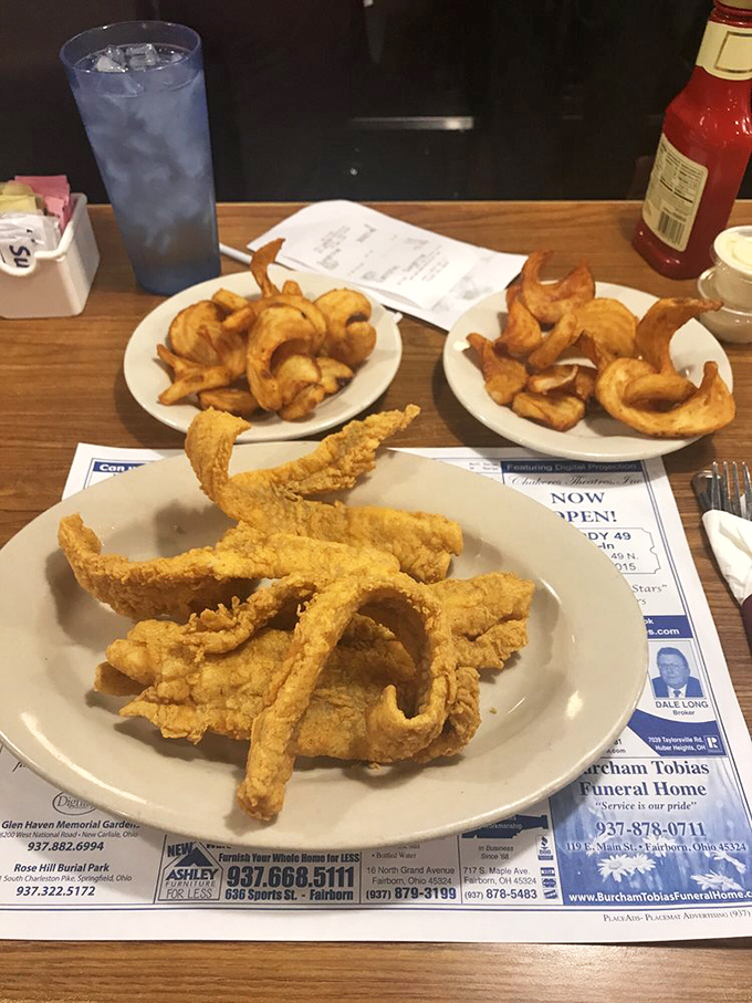 These onion rings and fried delights aren't just sides—they're supporting actors deserving of their own standing ovation.