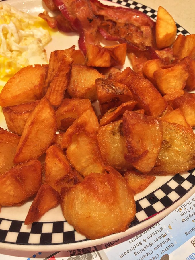 These aren't just any home fries – they're golden-brown potato nuggets of happiness, crispy outside and fluffy inside, like edible sunshine on a plate.
