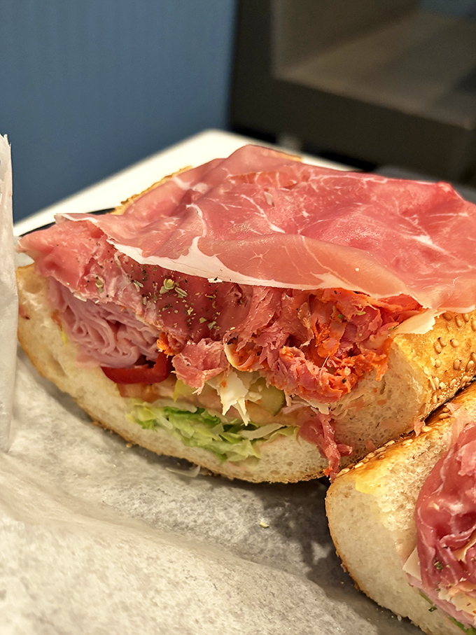 Layer upon layer of thinly sliced meat, the hallmark of sandwich artistry. This isn't just lunch—it's edible engineering at its finest.