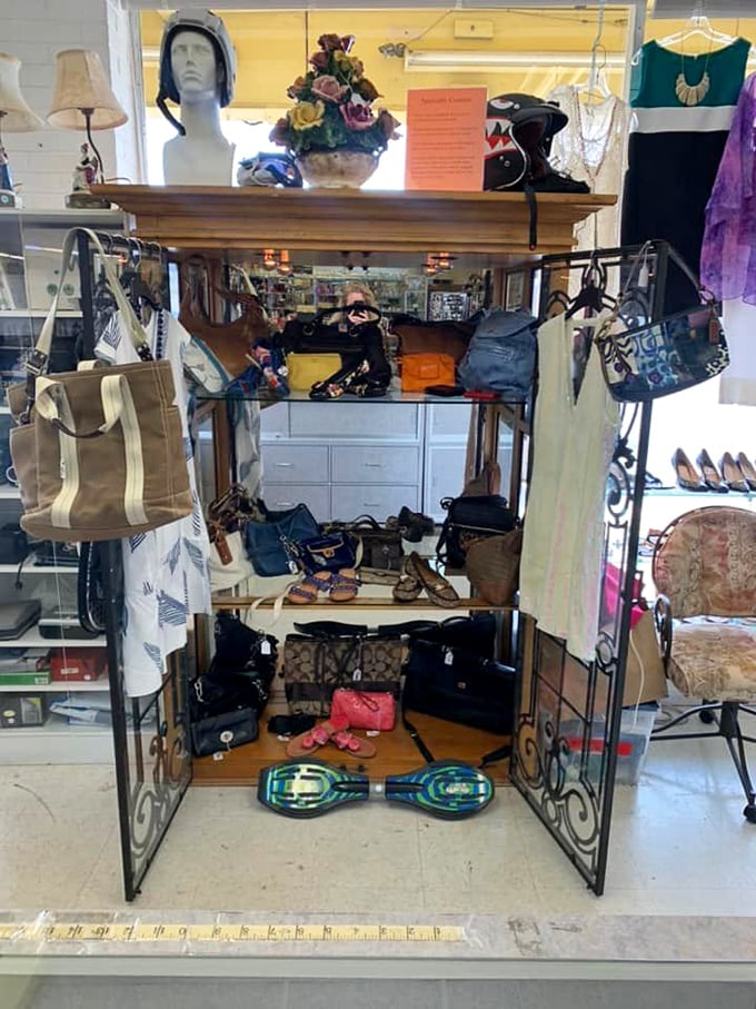 Handbag heaven on an ornate display—from beach totes to evening clutches, with a surprise hoverboard cameo stealing the spotlight below.