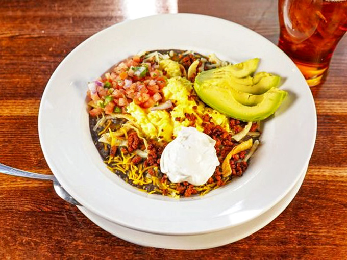 A fiesta on a plate! Eggs, cheese, avocado, and pico de gallo create a breakfast symphony that would make your taste buds dance the salsa.