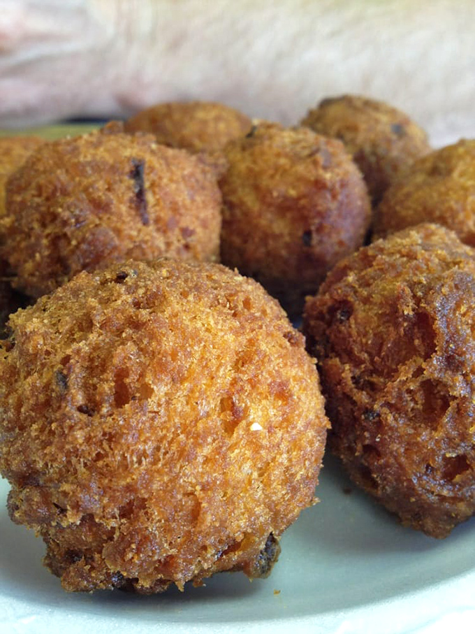 Hush puppies so perfectly golden they deserve their own trophy—crispy exterior giving way to a tender cornmeal interior that whispers "y'all come back now."