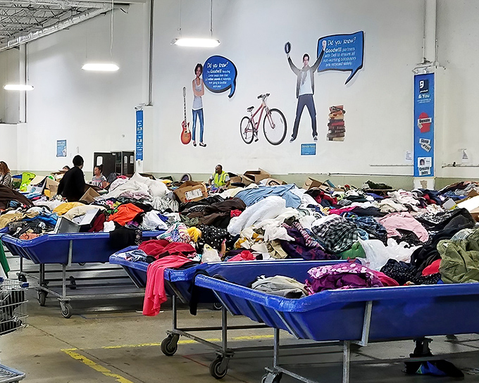 The organized chaos of bargain hunting heaven. Those hanging signs are like street signs in a city where every neighborhood offers different treasures.