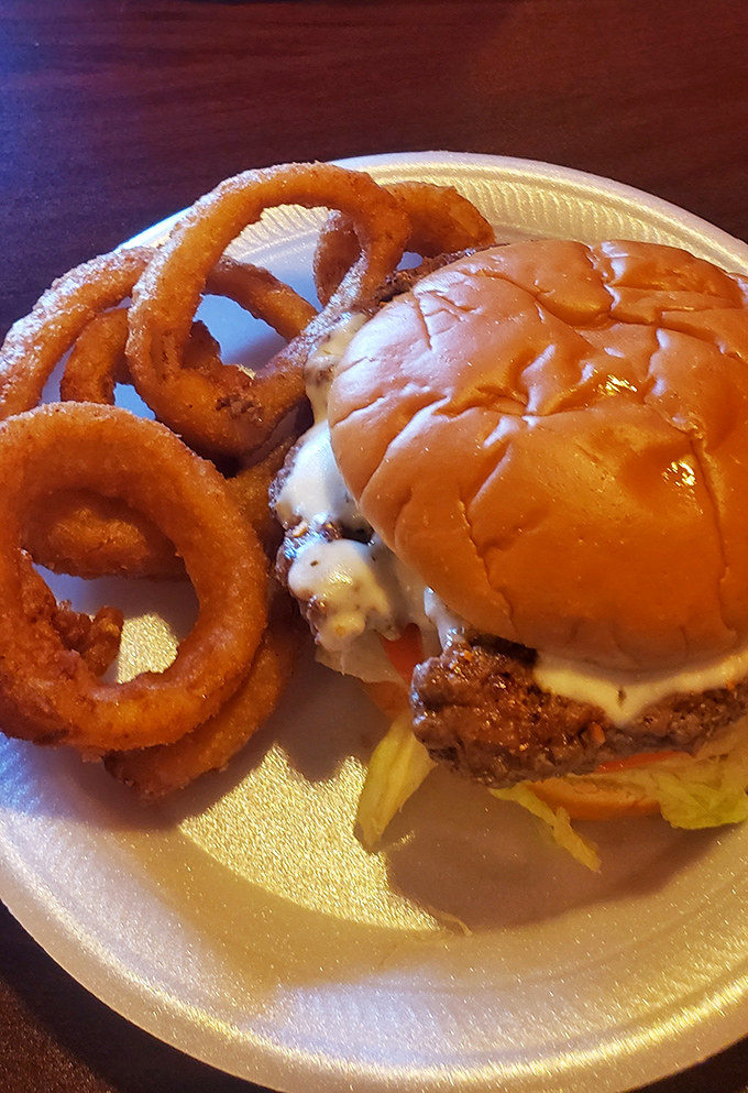 The perfect onion rings don't exi— Oh wait, there they are, golden halos accompanying a burger that demands your full attention.