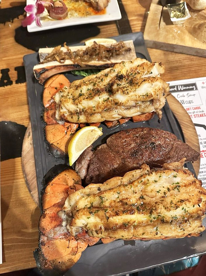 Surf meets turf in this magnificent display—lobster tails and steak proving that some partnerships are simply meant to be.