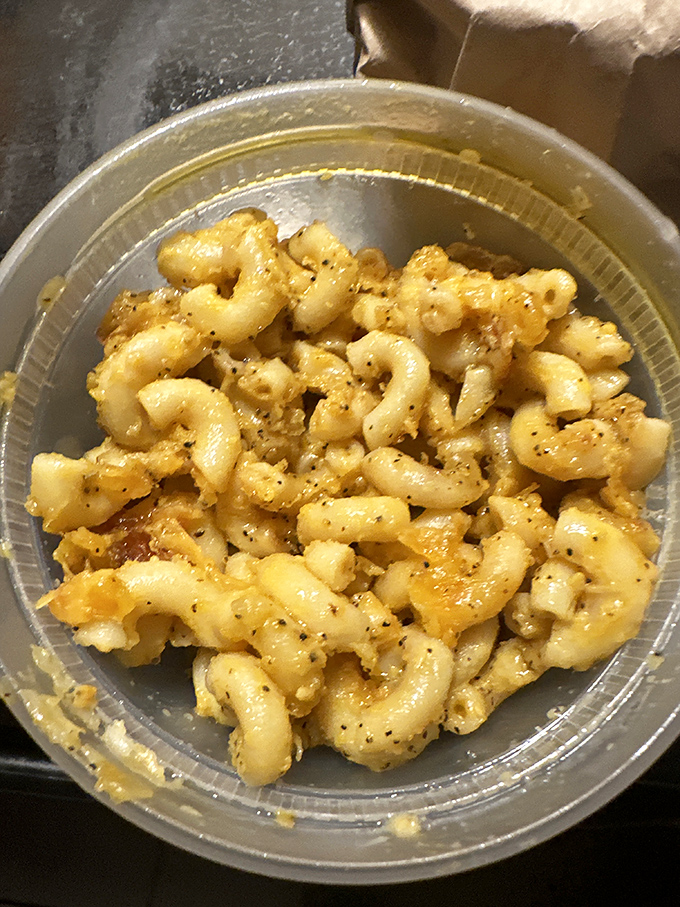 Mac and cheese that achieves that elusive perfect texture – creamy yet structured, with each pasta curve capturing maximum cheese goodness.