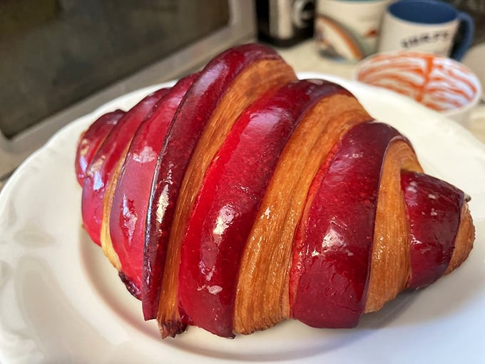 This berry-infused croissant wears its vibrant red glaze like formal attire—dressed up but still approachable, like a tuxedo t-shirt.