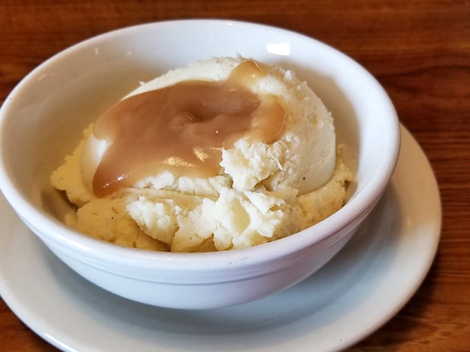 Mashed potatoes so perfectly cloud-like, they make you wonder if the chef moonlights as a pillow designer.