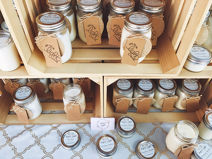 Mason jar candles with rustic tags—the perfect gift for that friend who has everything except, apparently, enough scented candles.