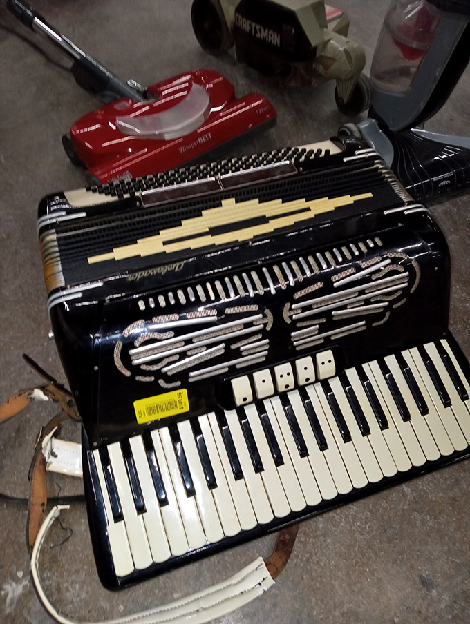 An accordion waiting for its second serenade – musical instruments here cost less than a few music lessons elsewhere.