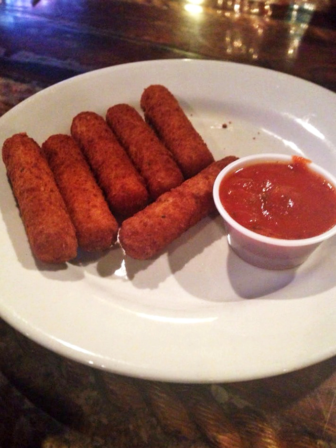 Golden-brown mozzarella sticks lined up like soldiers ready for battle—the battle against your hunger, that is. Crispy outside, molten inside, happiness all around.