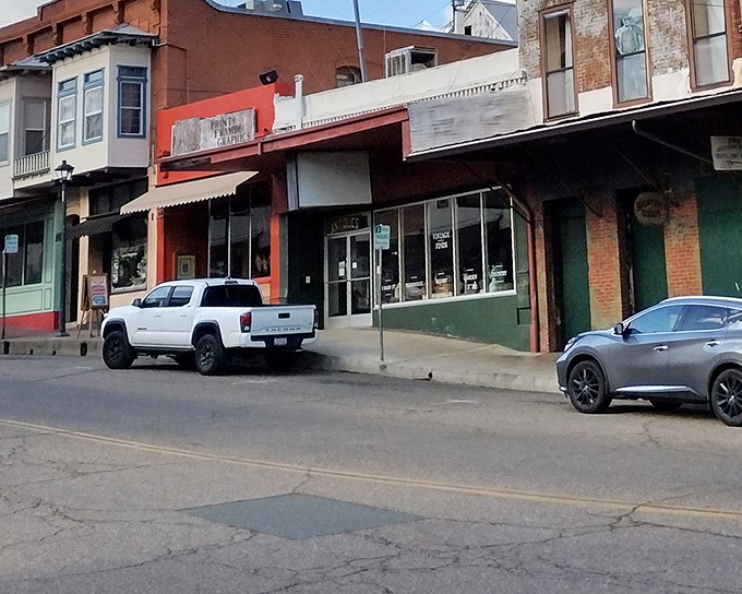 Classic brick storefronts maintain their dignified charm while housing businesses that serve today's needs – the essence of small-town adaptation.