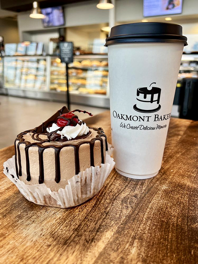 Chocolate drizzle cascading down buttercream mountains—this little cake doesn't just satisfy cravings, it silences them into respectful submission.