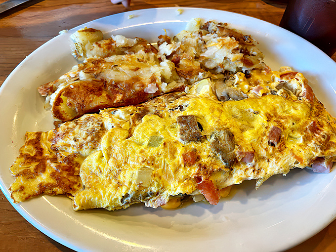 This isn't just an omelet; it's a masterclass in how eggs should be treated—fluffy, generously filled, and perfectly executed.