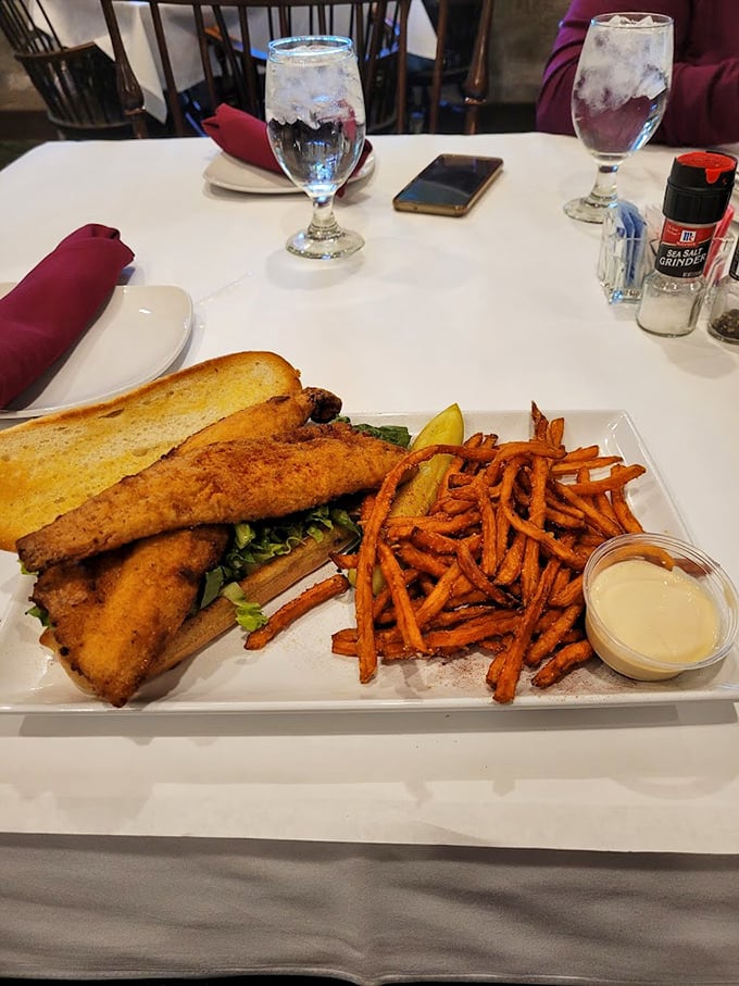 Who knew a fish sandwich could look this impressive? Crispy perch paired with sweet potato fries—a Great Lakes classic elevated to art form.