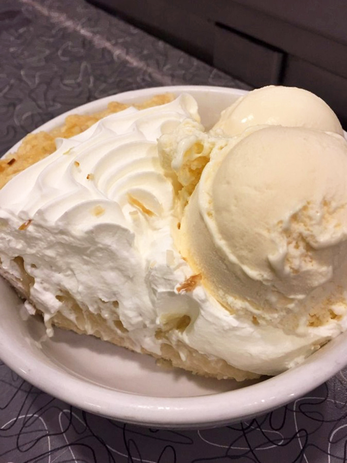 Pie that would make your grandmother simultaneously proud and jealous. That cloud of whipped cream isn't just a topping—it's a halo.