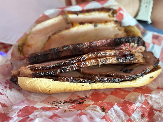 When sliced pork loin meets a soft bun, magic happens. This sandwich isn't just lunch—it's an edible love letter to Texas barbecue tradition.