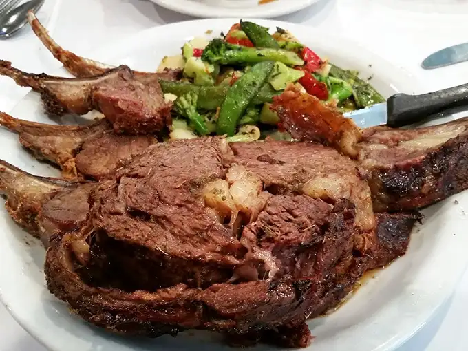A prime rib that doesn't just steal the show—it buys the theater and rewrites the script. Those vegetables are just along for the ride.