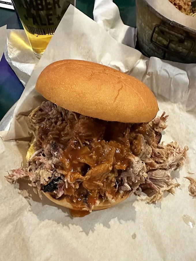This pulled pork sandwich isn't just a meal—it's an edible love letter from the pit master to your taste buds.