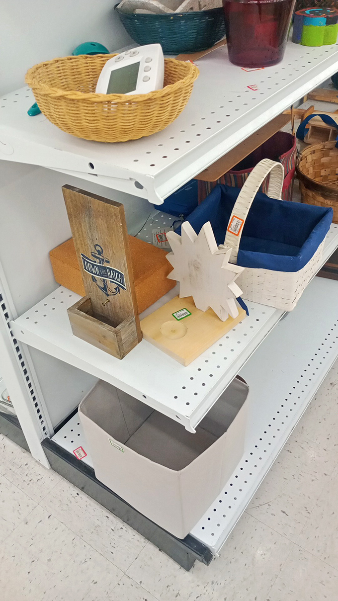 Home décor treasures nestled among practical finds. That "Down to the Beach" wooden box probably held someone's shell collection before landing here