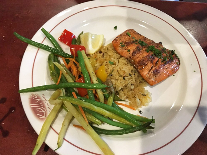 Salmon that's been kissed by flame and paired with colorful vegetables—proof that healthy eating doesn't have to be punishment.