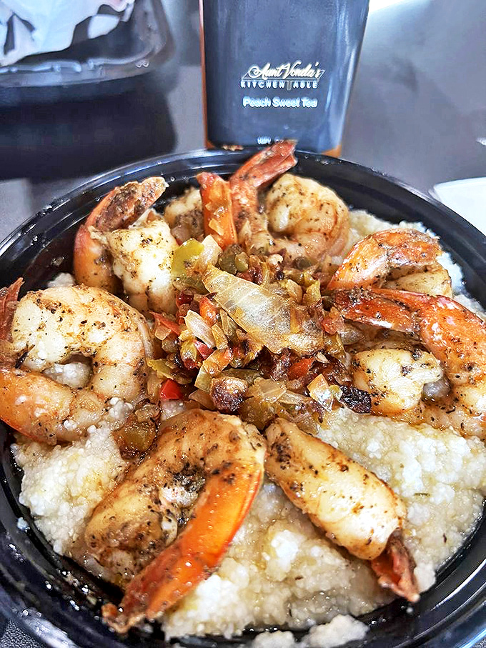 Shrimp so perfectly seasoned and sautéed, they're practically doing a happy dance atop that bed of creamy grits.