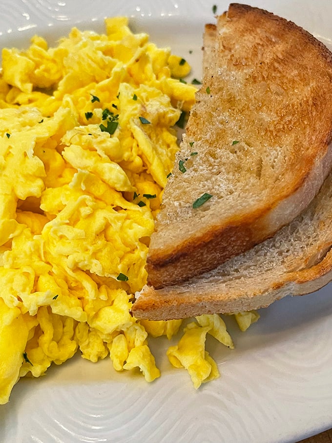 Scrambled eggs so perfectly fluffy they could teach masterclasses to brunch spots across America.