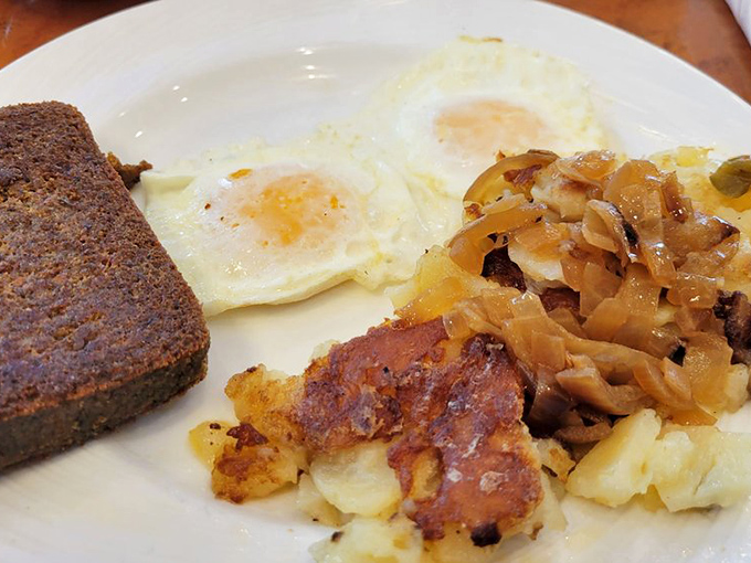 A classic breakfast trinity: eggs, potatoes, and scrapple—the holy Delaware breakfast experience that tourists puzzle over and locals worship.