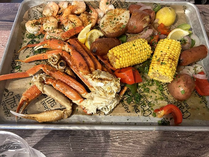 This seafood platter isn't a meal, it's a maritime celebration—snow crab legs, shrimp, corn, and potatoes all having a party on a tray.