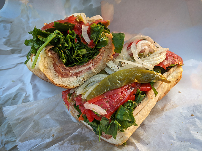 The Italian hoagie, cross-sectioned like a geological marvel. Years of sandwich evolution have created these perfect strata of flavor.