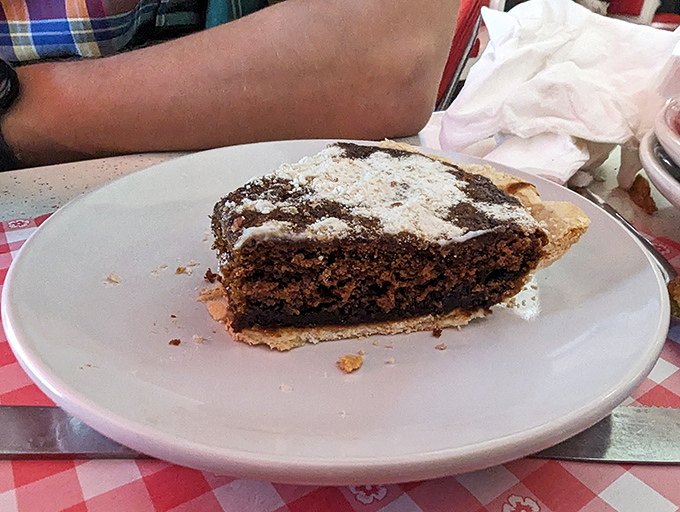 Shoofly pie—Pennsylvania Dutch soul food on a plate. This molasses masterpiece proves some traditions are worth preserving, especially when dusted with powdered sugar.